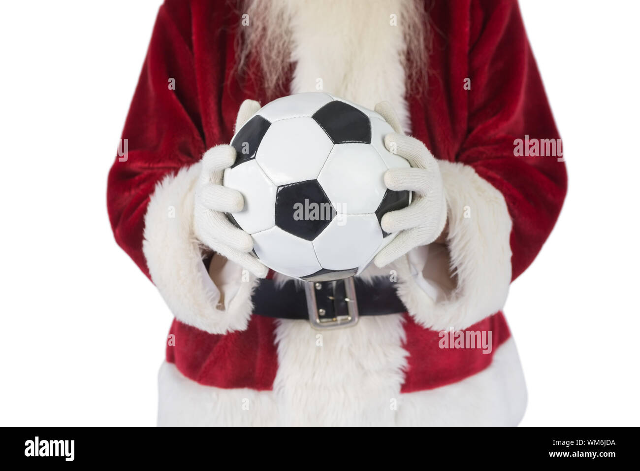 Santa holds a classic football on white background Stock Photo - Alamy