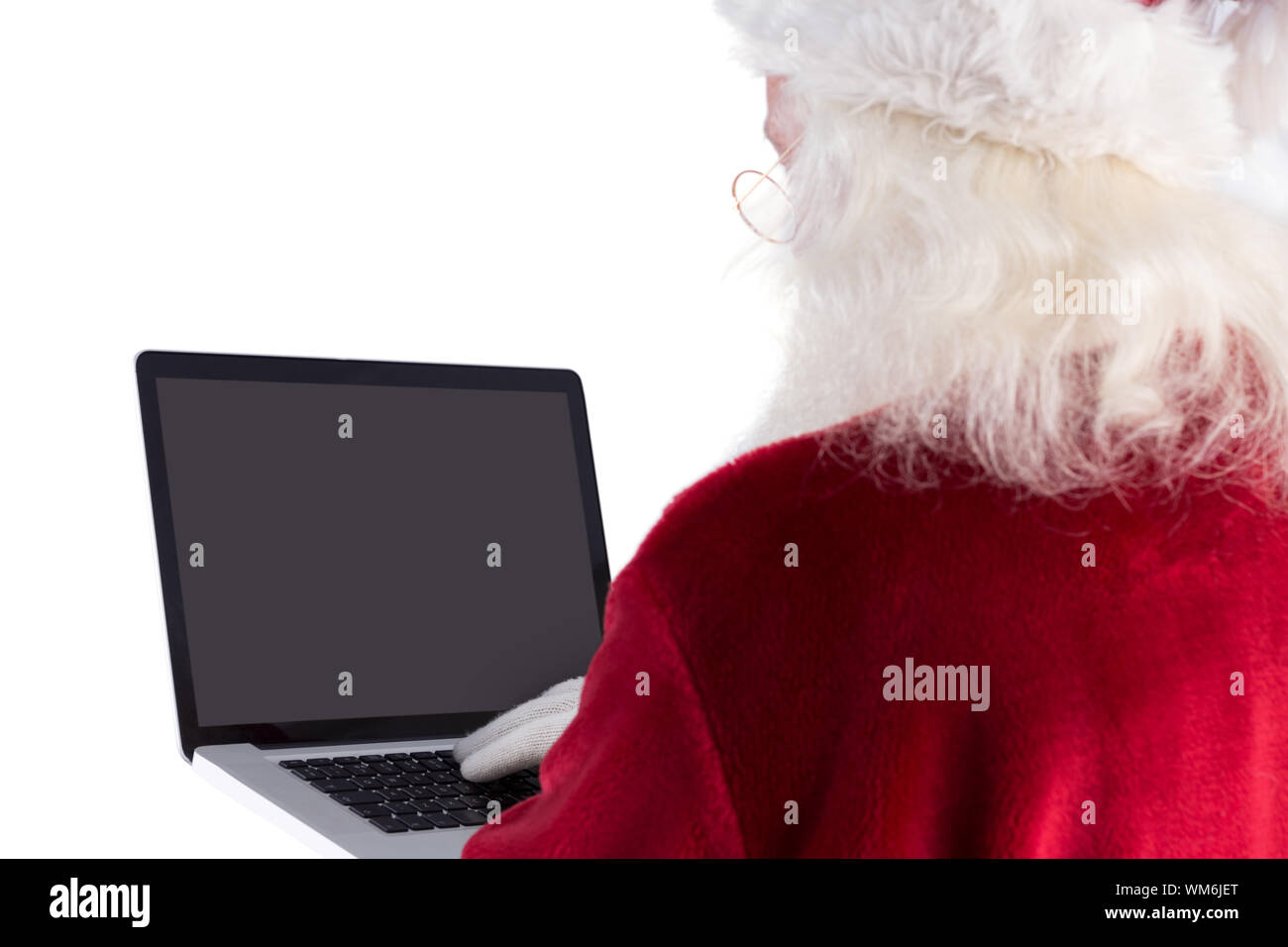 Santa Claus uses a laptop on white background Stock Photo - Alamy