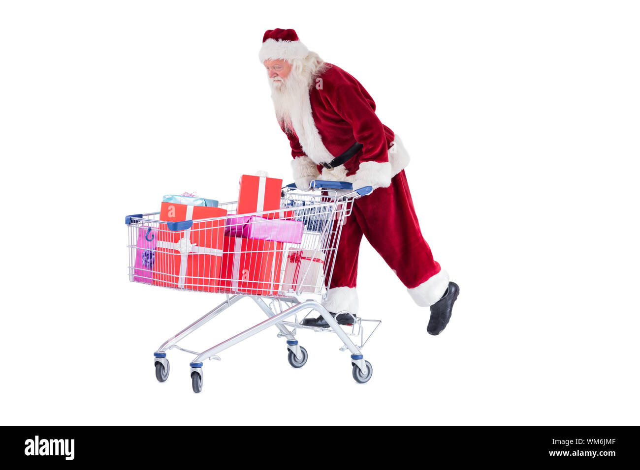 Santa rides on a shopping cart on white background Stock Photo - Alamy
