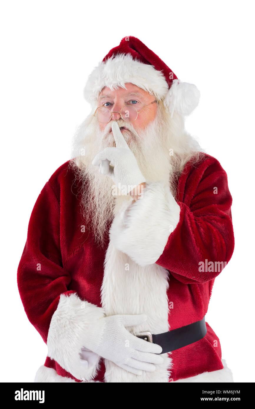 Santa asking for quiet to camera on white background Stock Photo - Alamy