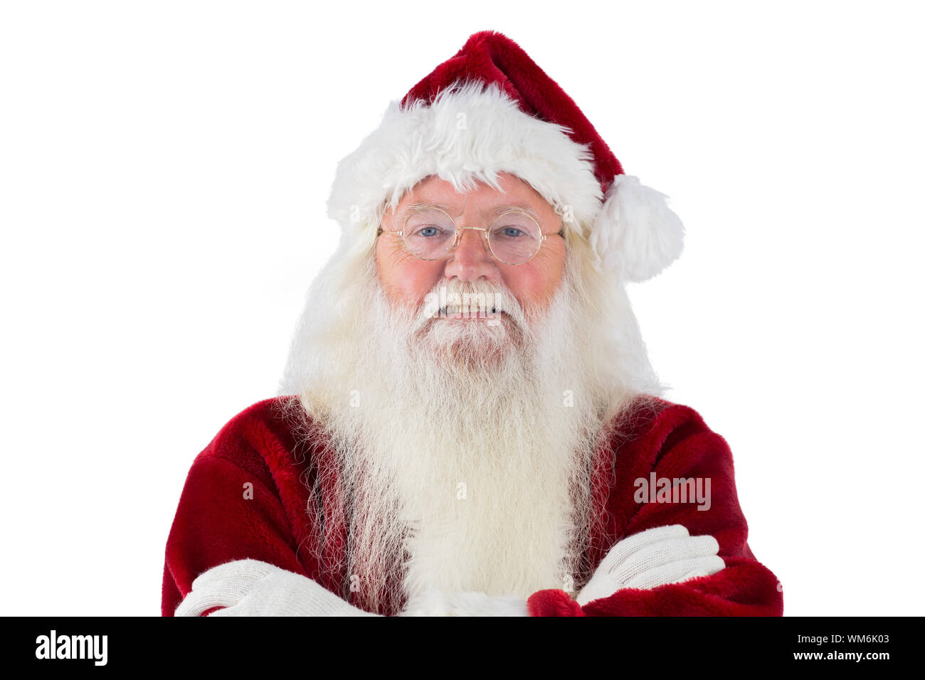 Santa smiles with folded arms on white background Stock Photo - Alamy