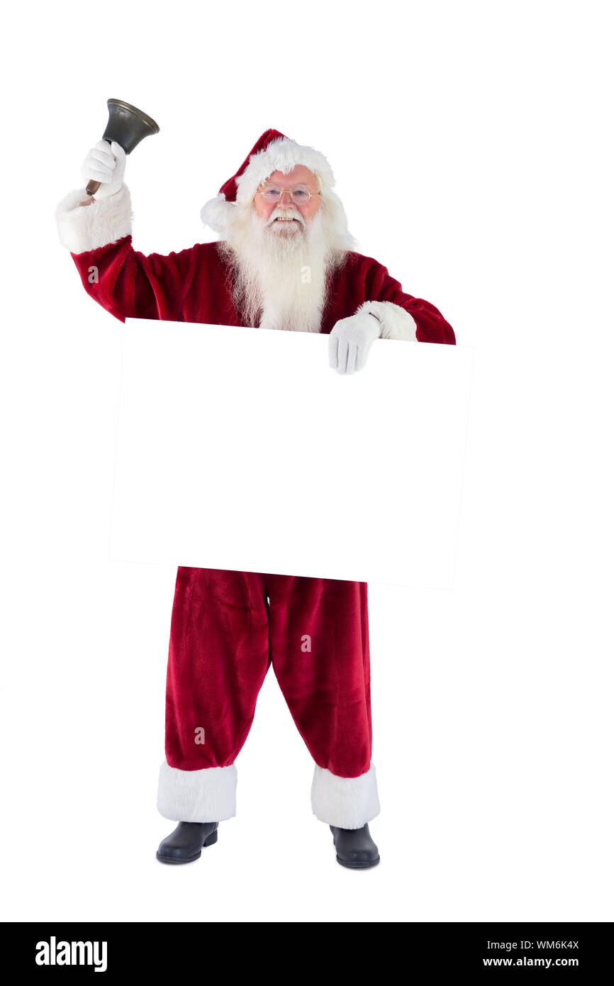 Santa holds a sign and rings his bell on white background Stock Photo ...