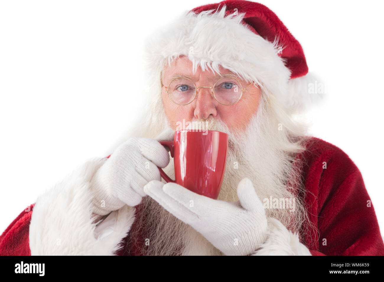Santa drinks from a red cup on white background Stock Photo - Alamy
