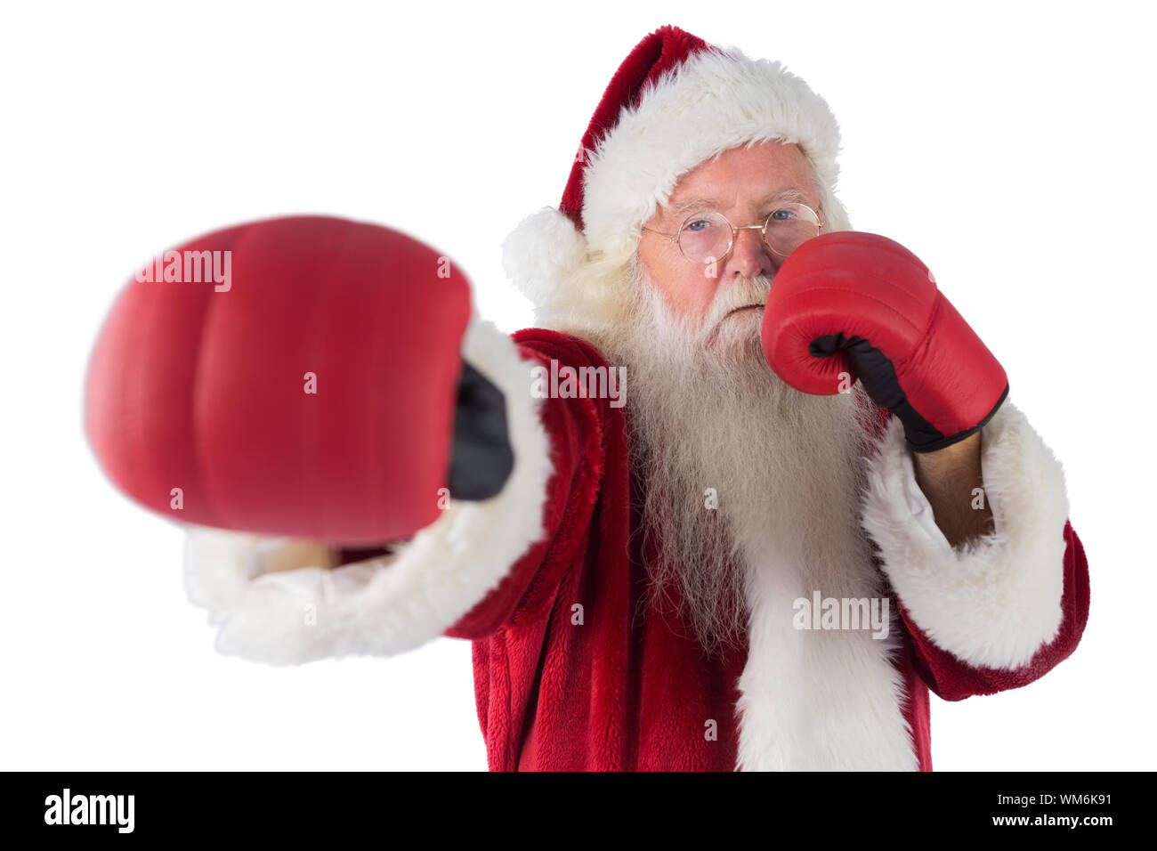 Santa Claus punches with his right on white background Stock Photo - Alamy