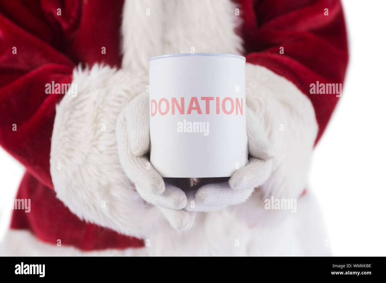 Santa holds a can for donations on white background Stock Photo - Alamy