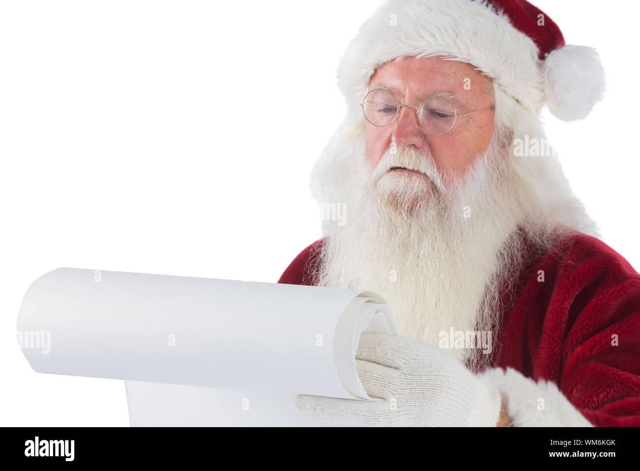 Santa Claus reads a list on white background Stock Photo - Alamy