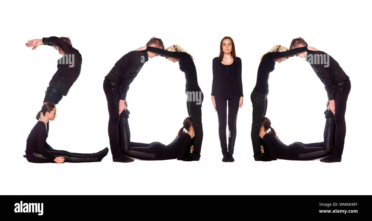 Group of people forming the word '2010', isolated on white background ...