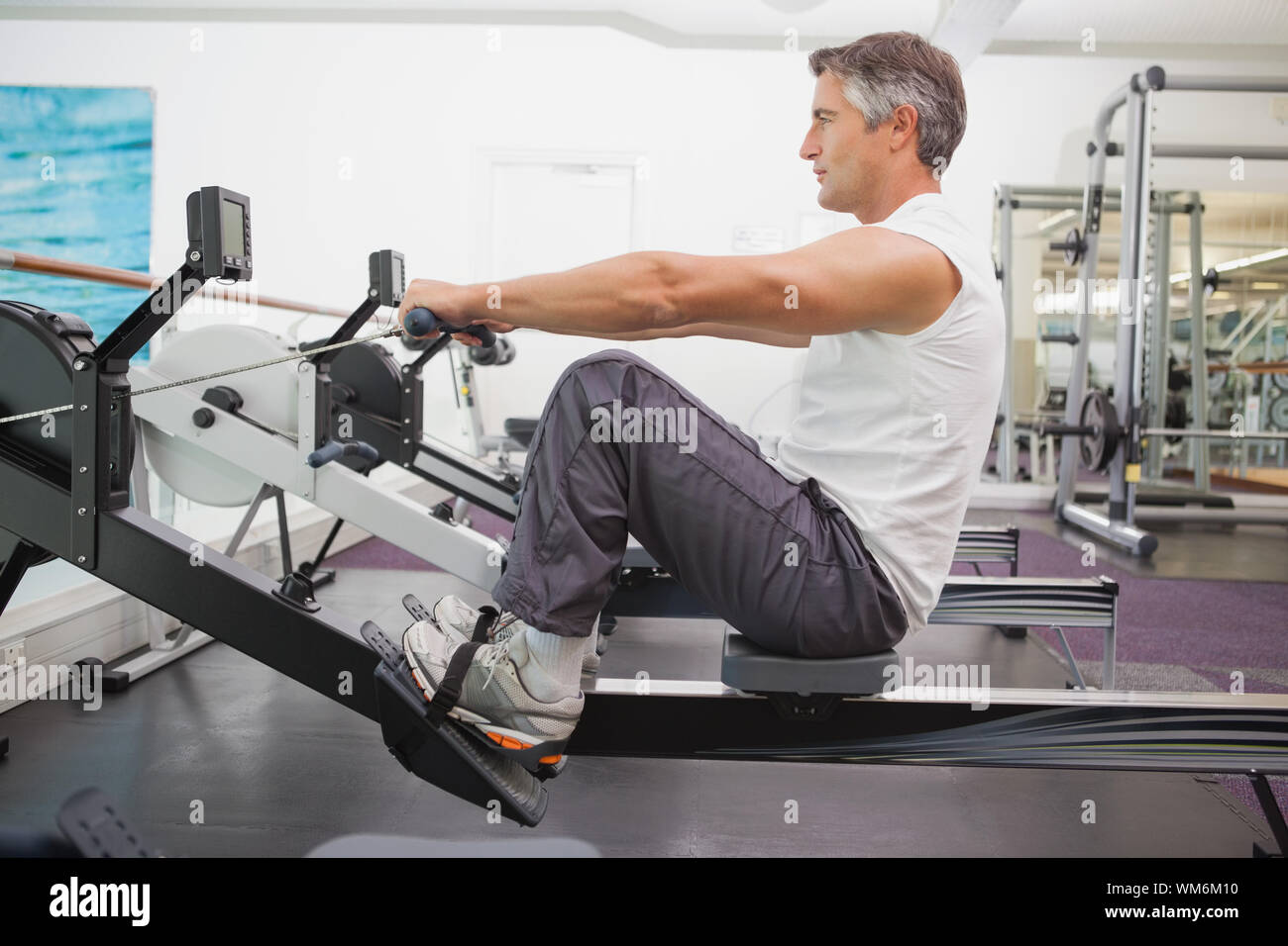 Man working out on rowing hi-res stock photography and images - Alamy