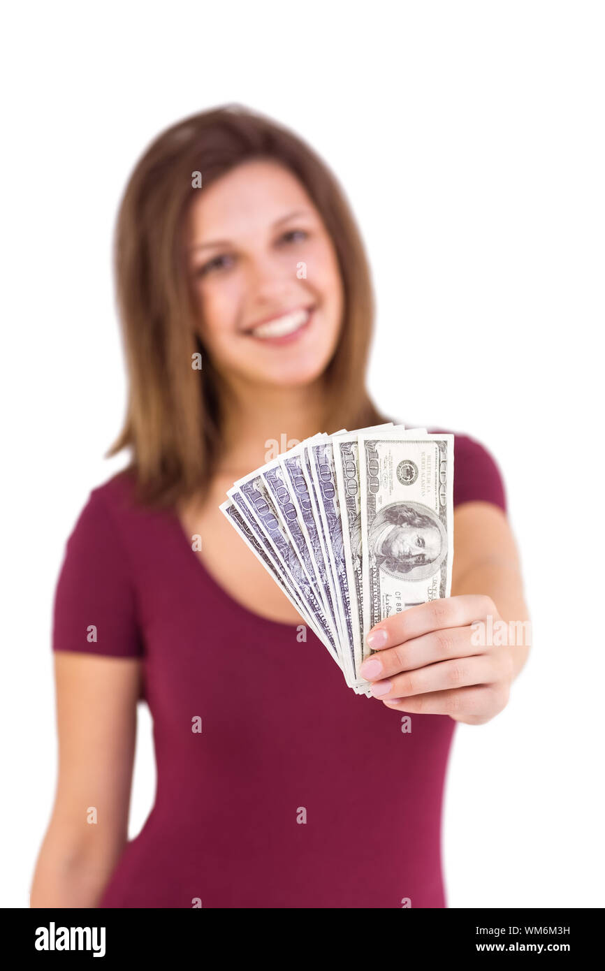 Festive brunette in dress showing her cash on white background Stock ...