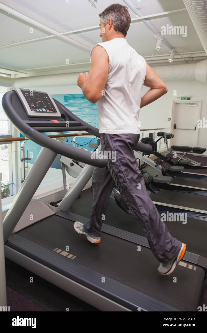 Determined man running on treadmill hi-res stock photography and images ...
