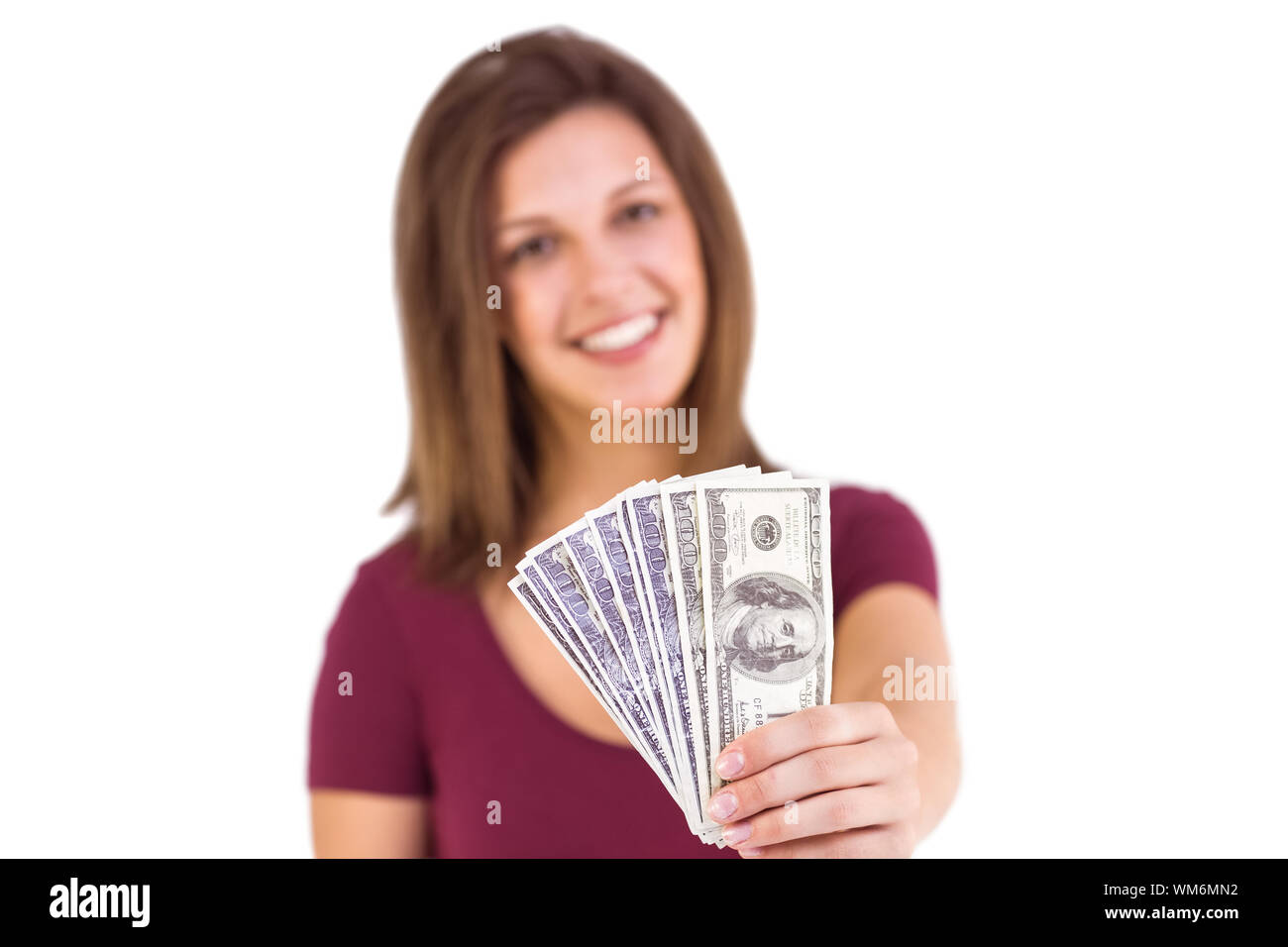 Festive brunette in dress showing her cash on white background Stock ...