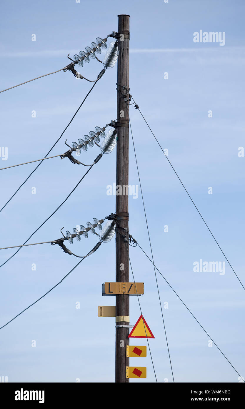 Warning signs on a electricity pylon with short focal depth Stock Photo ...