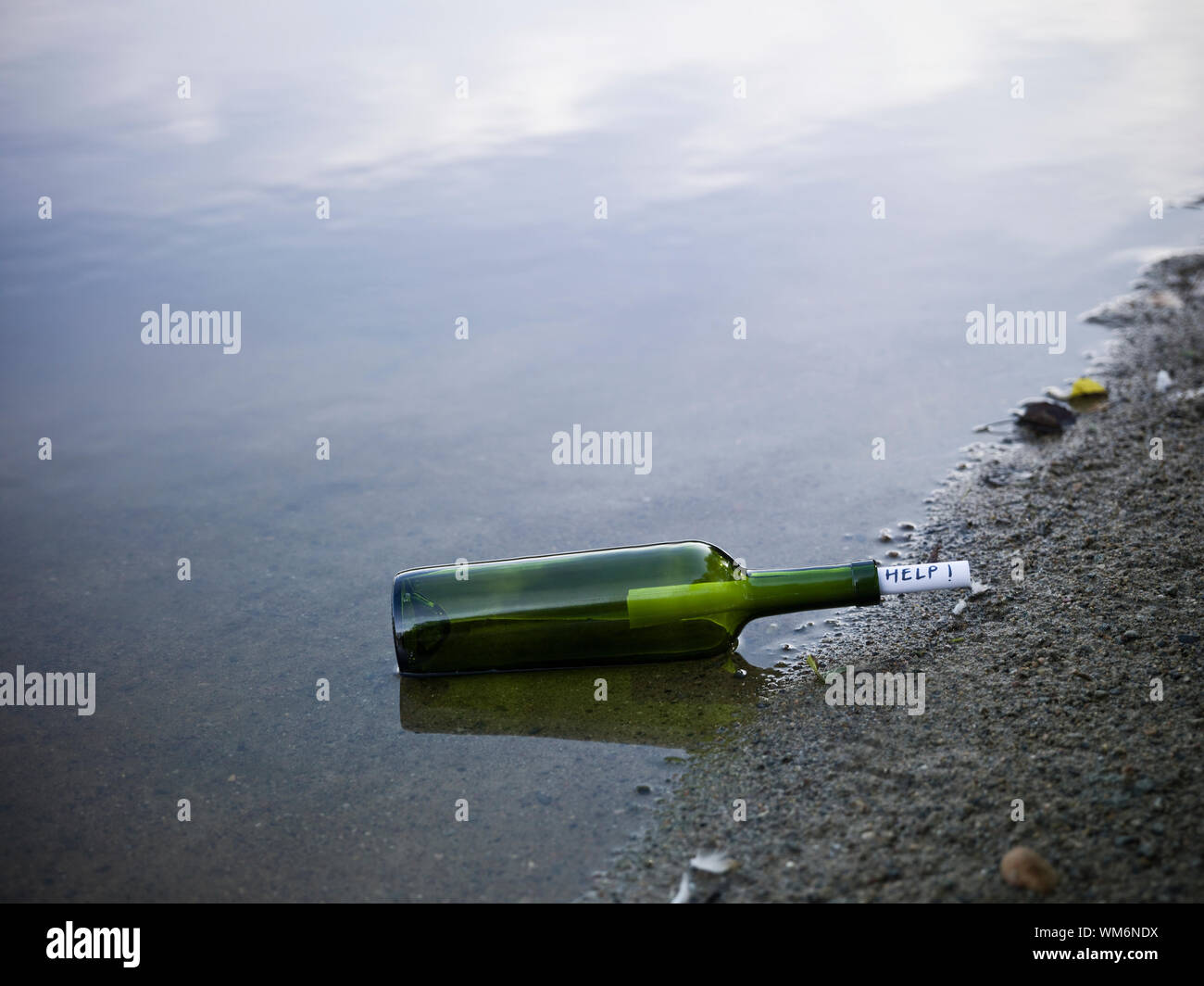 The word 'help' enclosed in a bottle Stock Photo - Alamy