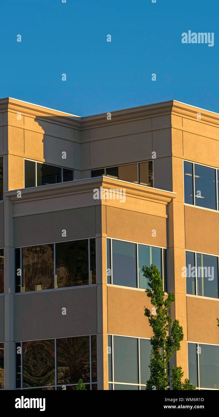 Vertical frame Modern building exterior with concrete wall and shiny ...