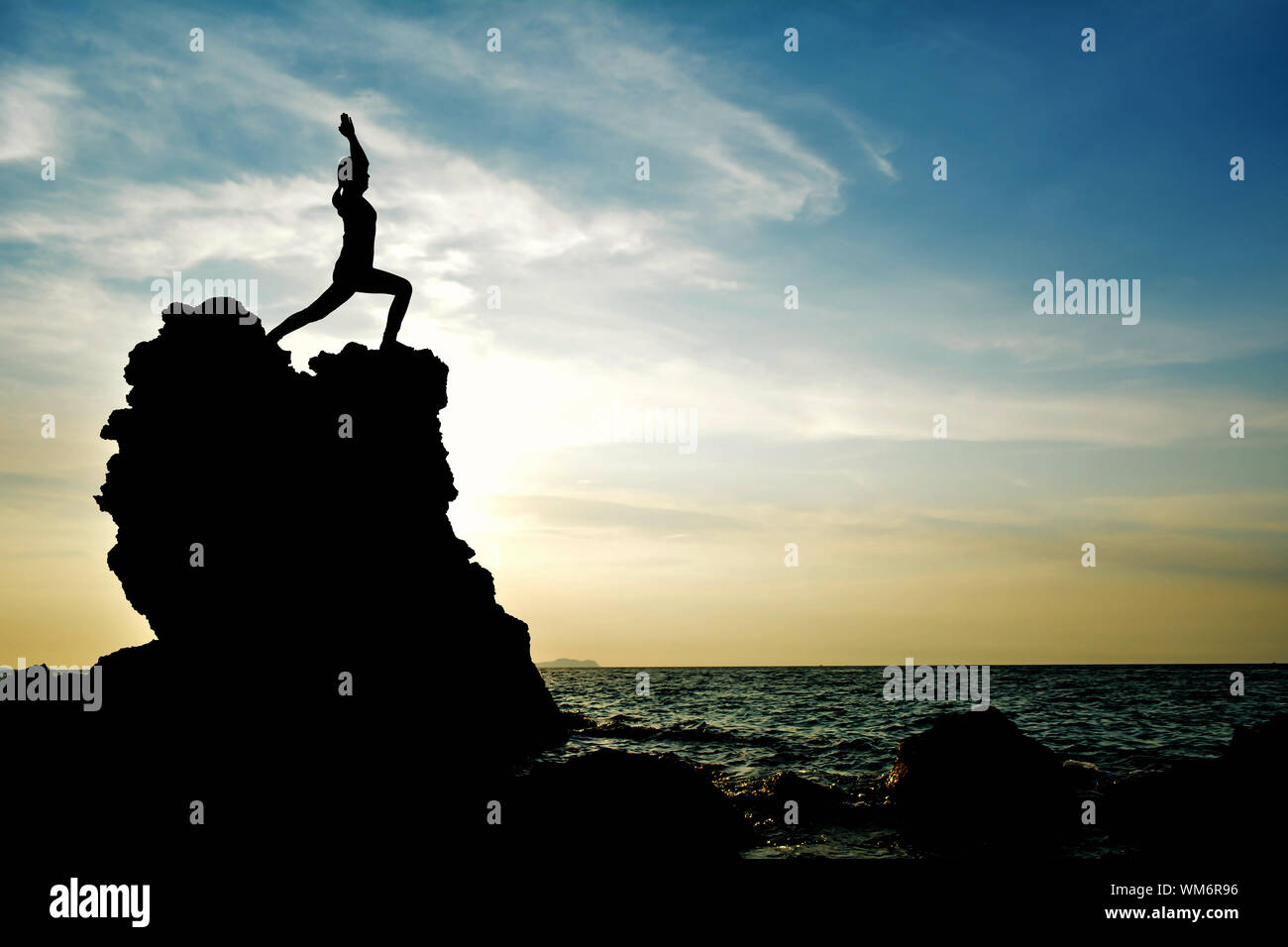 Sunset with rock silhouette hi-res stock photography and images - Alamy