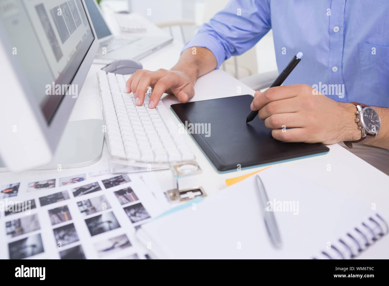 Graphic designer using digitizer at his desk in creative office Stock ...
