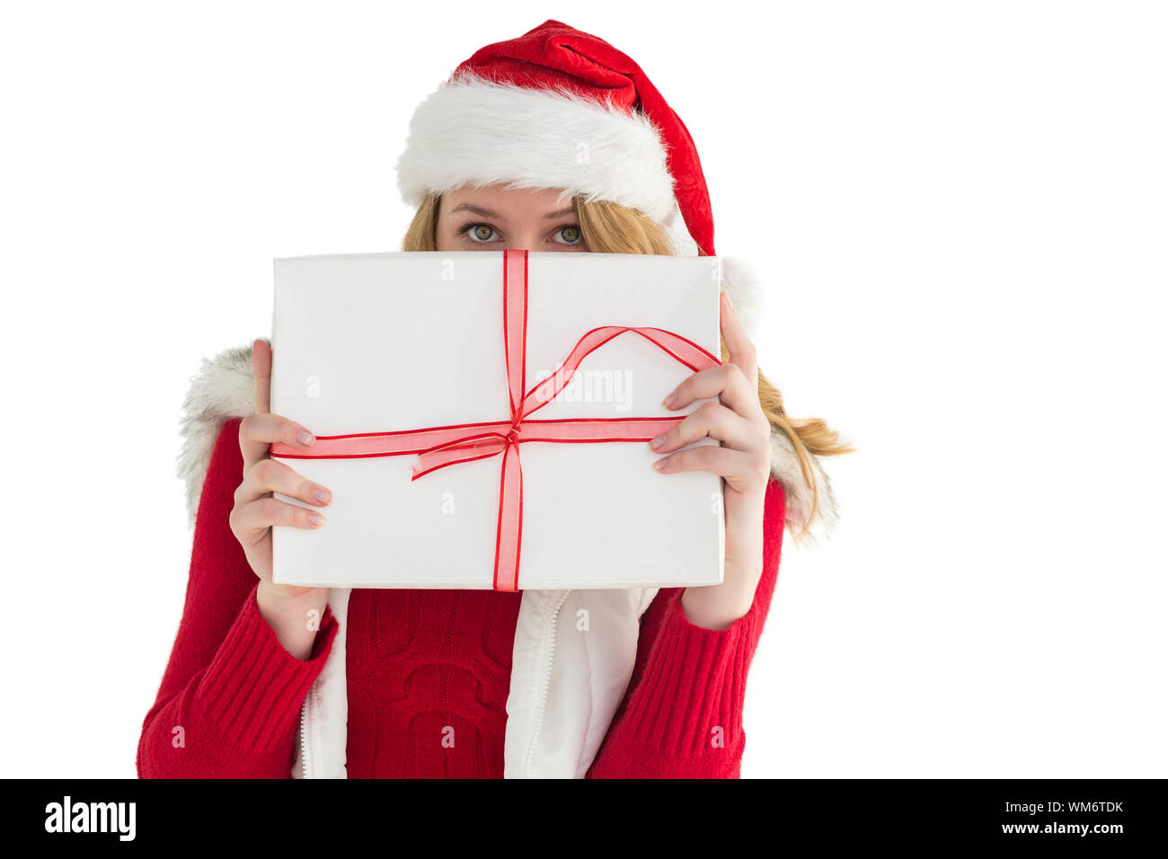 Blonde woman hiding behind a gift on white background Stock Photo - Alamy