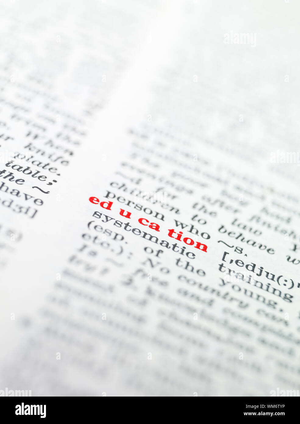 The word 'education' highlighted in a dictionary Stock Photo - Alamy