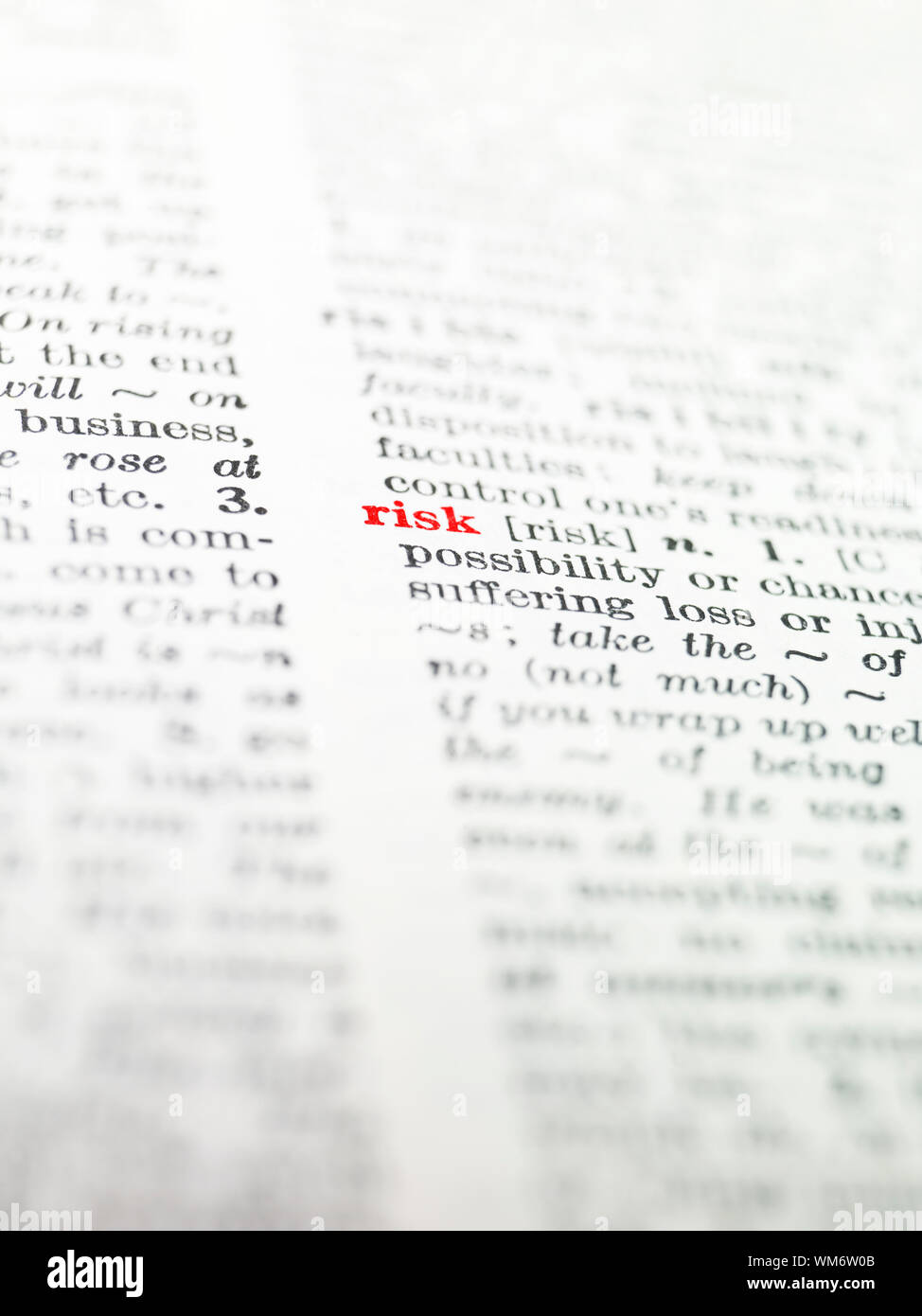 The word 'risk' highlighted in a dictionary Stock Photo - Alamy