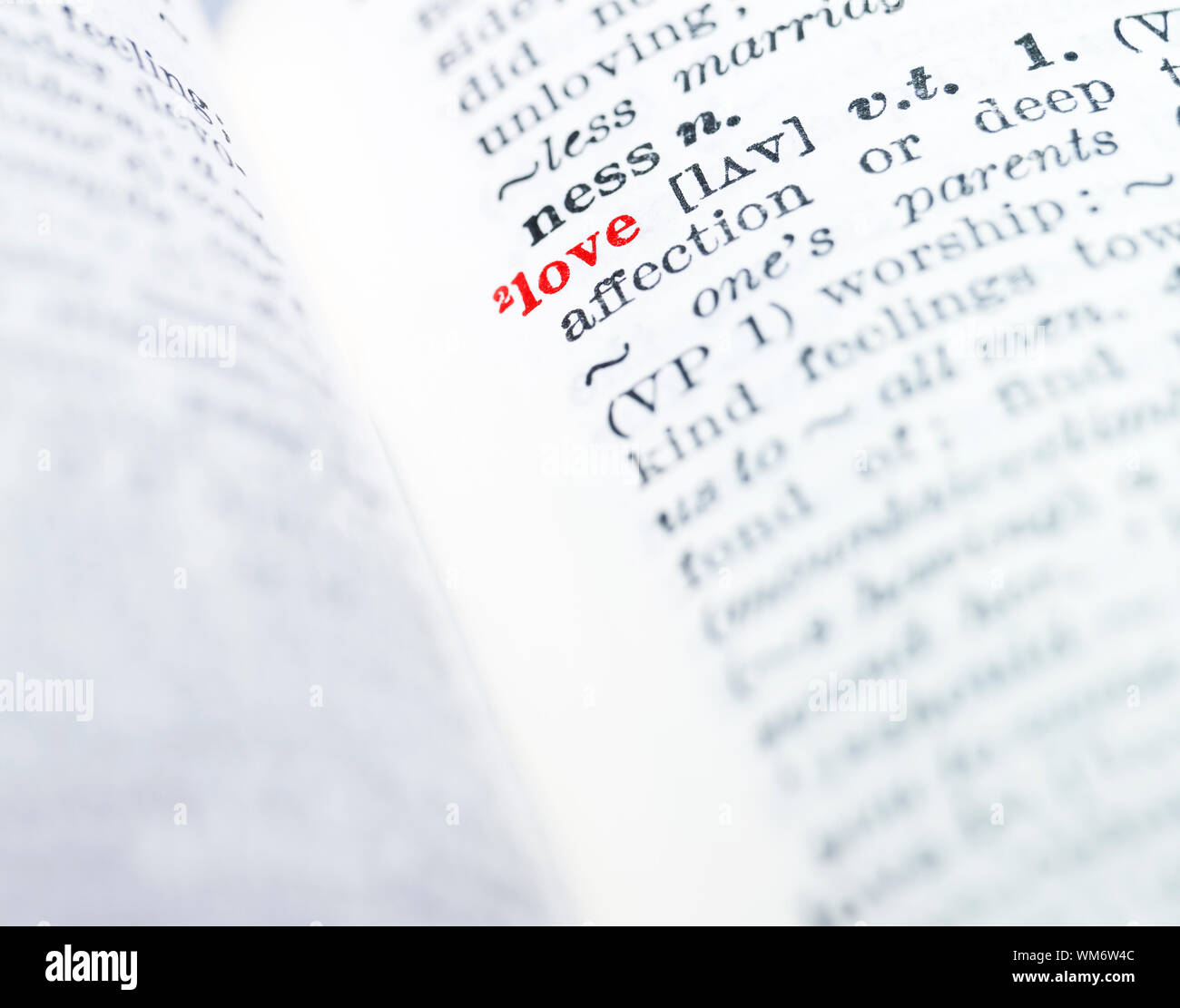 The word 'love' highlighted in a dictionary Stock Photo - Alamy