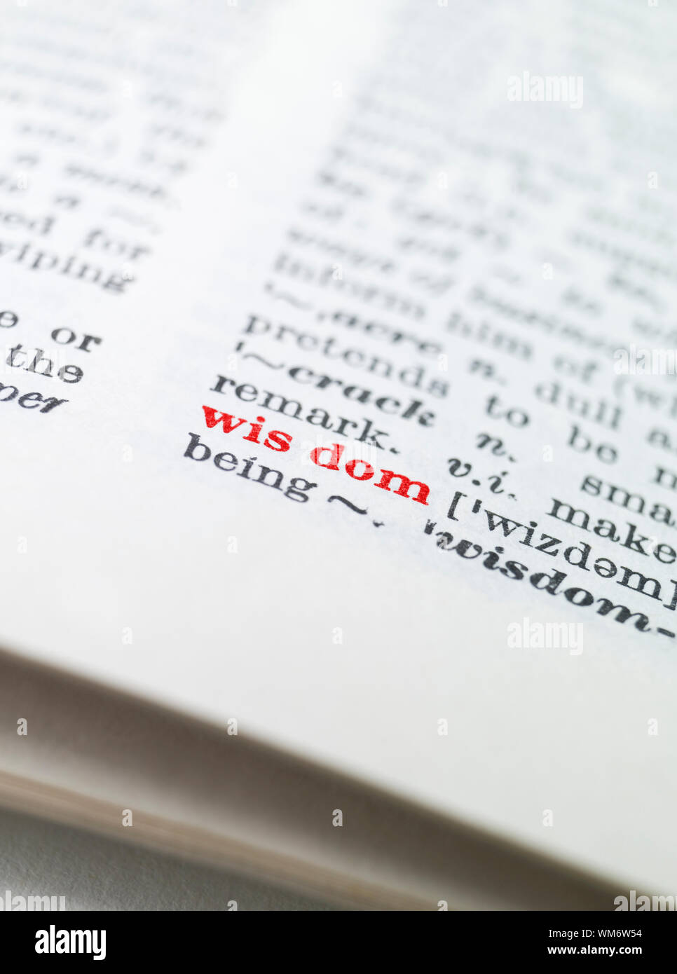 The word 'wisdom' highlighted in a dictionary Stock Photo - Alamy