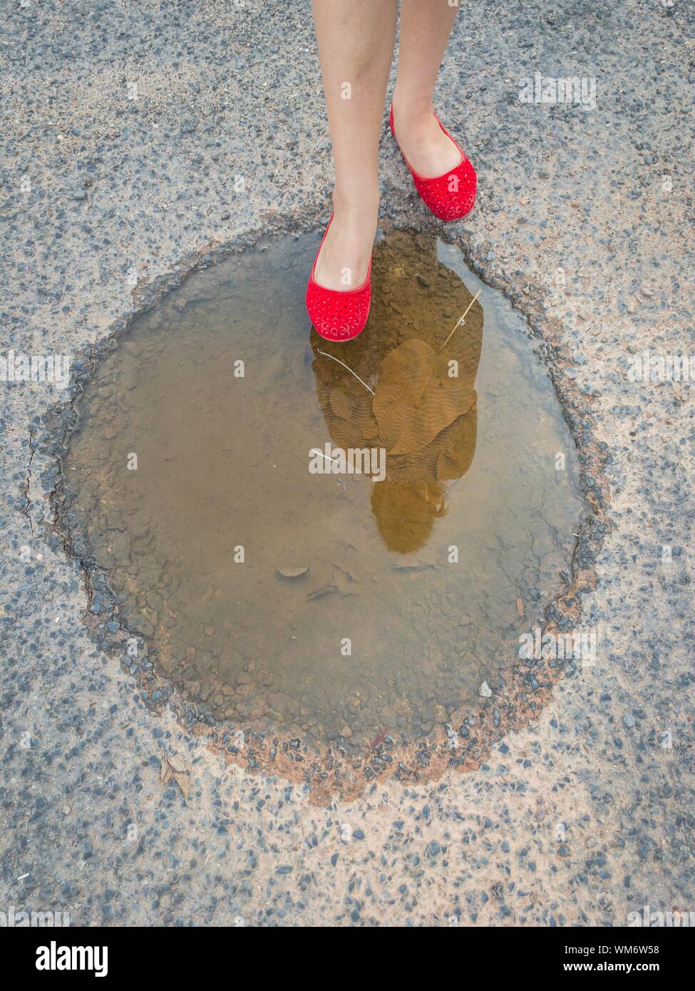 Child puddle adult hi-res stock photography and images - Alamy