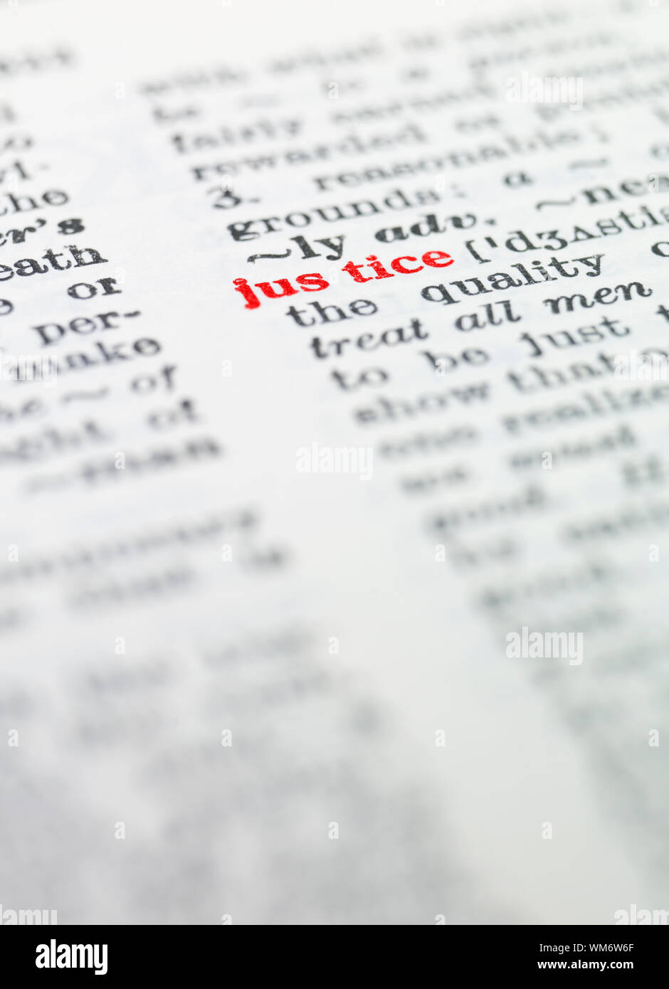 The word 'justice' highlighted in a dictionary Stock Photo - Alamy