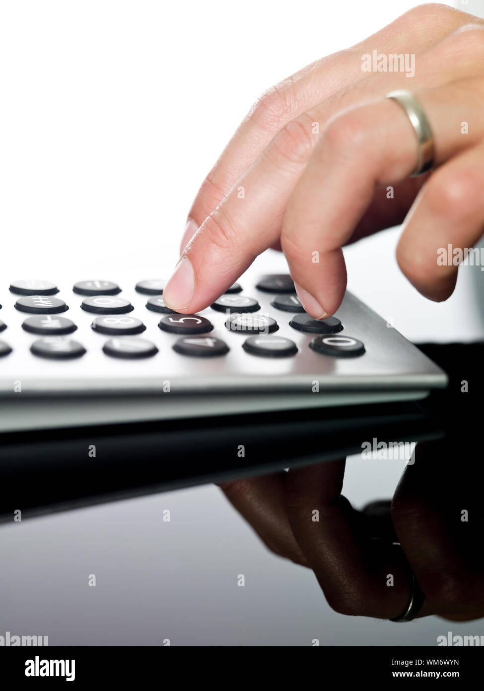 Man doing financial calculations Stock Photo - Alamy