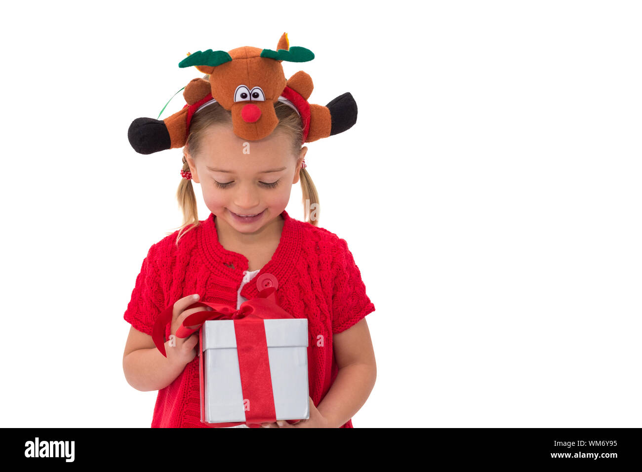 Cute little girl wearing rudolph headband on white background Stock ...