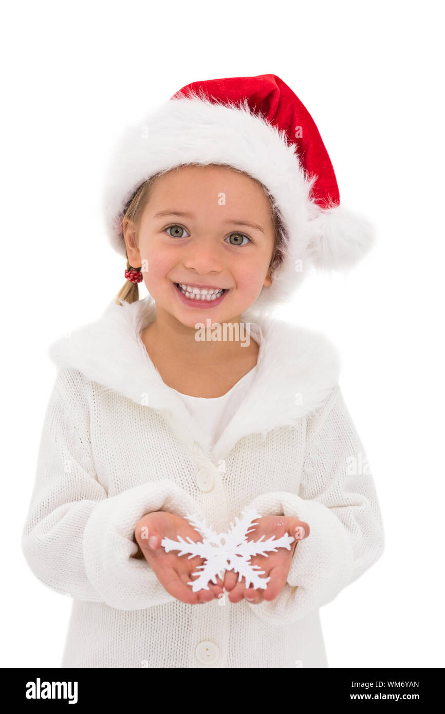 Festive little girl holding snowflake on white background Stock Photo ...