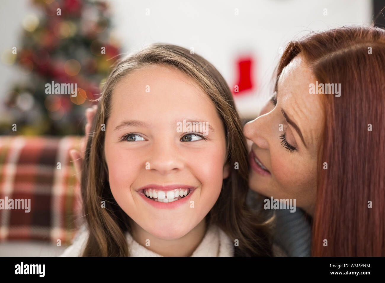 Smiling mother telling daughter hi-res stock photography and images - Alamy