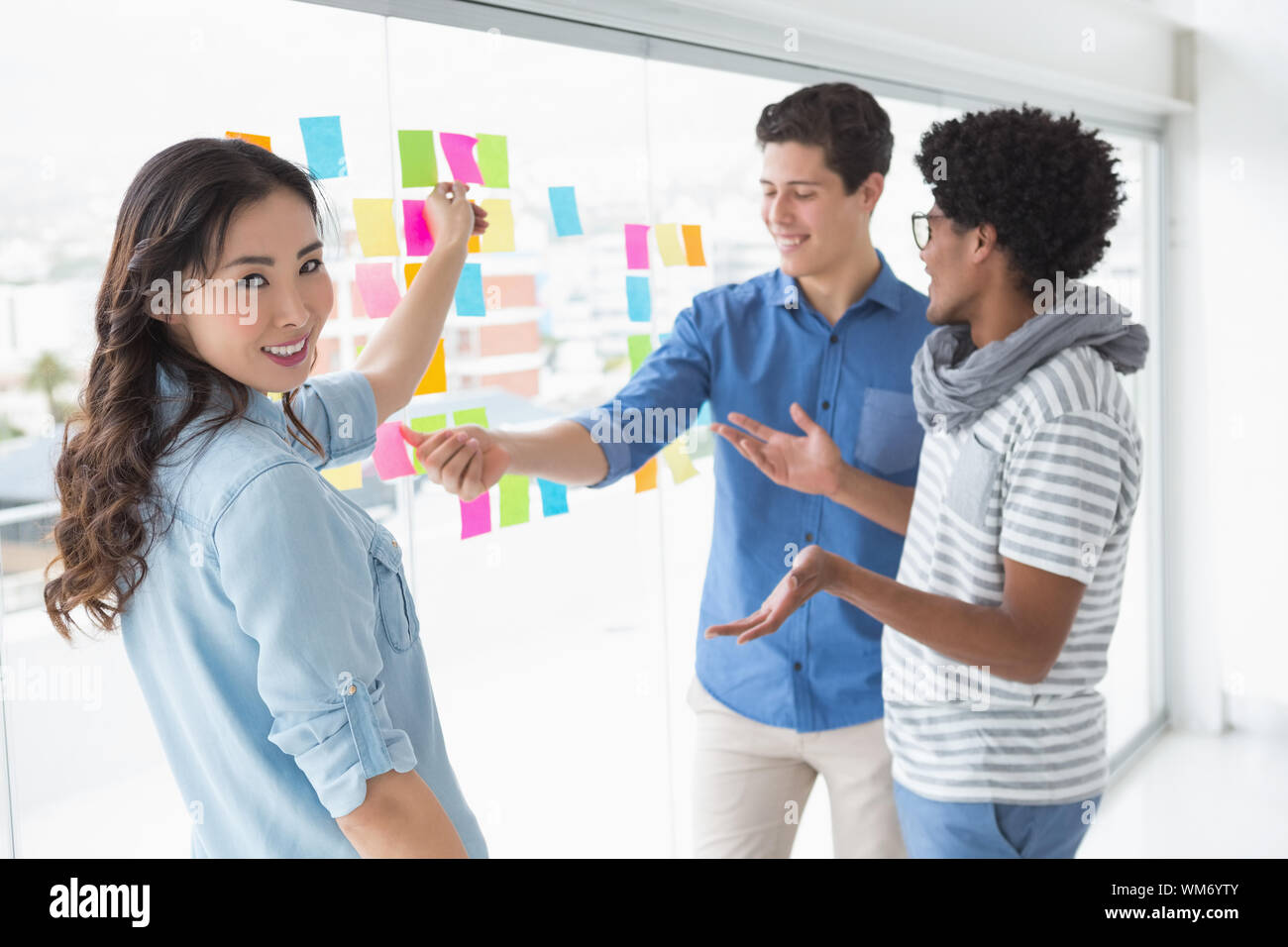 Young creative team brainstorming together in creative office Stock ...