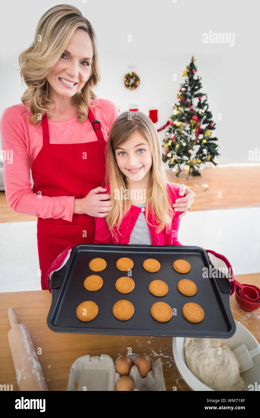 Happy girl showing cookie hi-res stock photography and images - Alamy