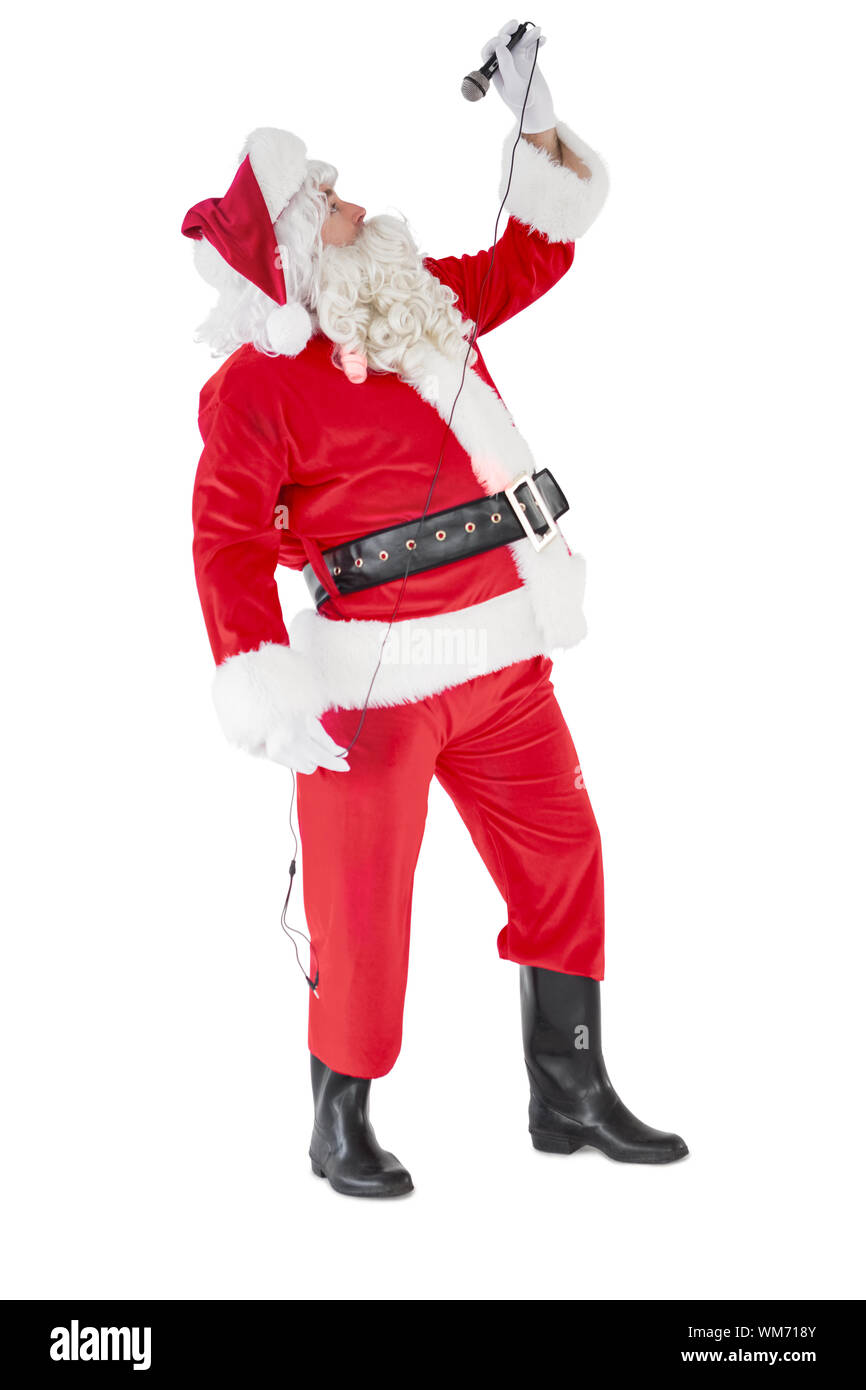 Happy santa claus singing with microphone on white background Stock ...