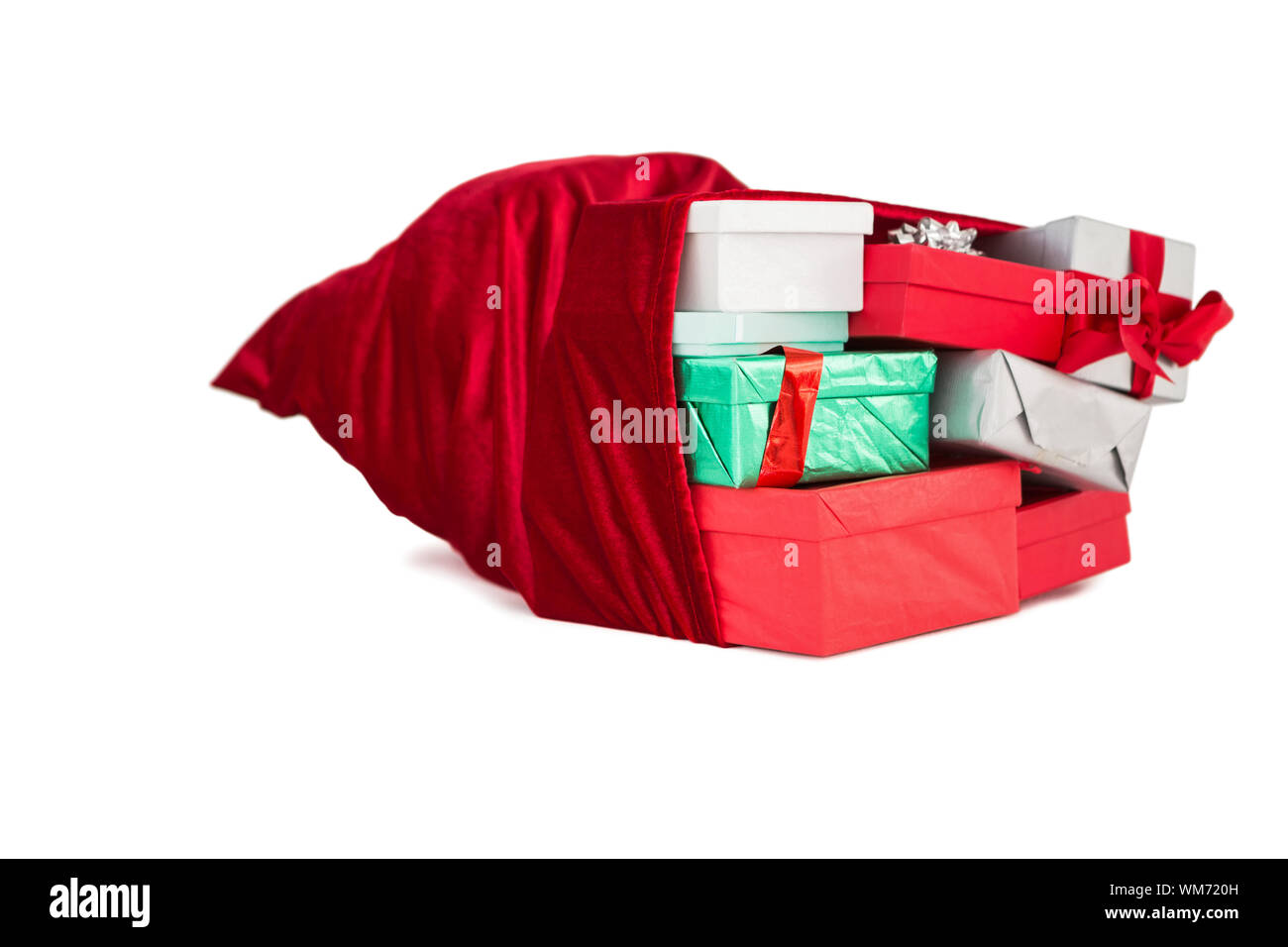 Red sack full of gifts on white background Stock Photo - Alamy