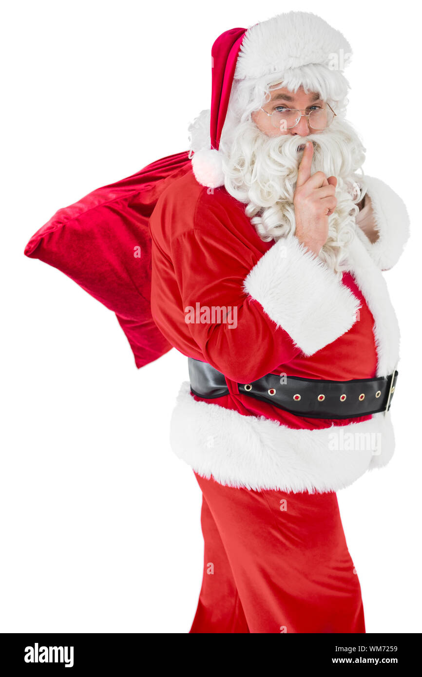 Santa keeping a secret and holding his sack on white background Stock ...