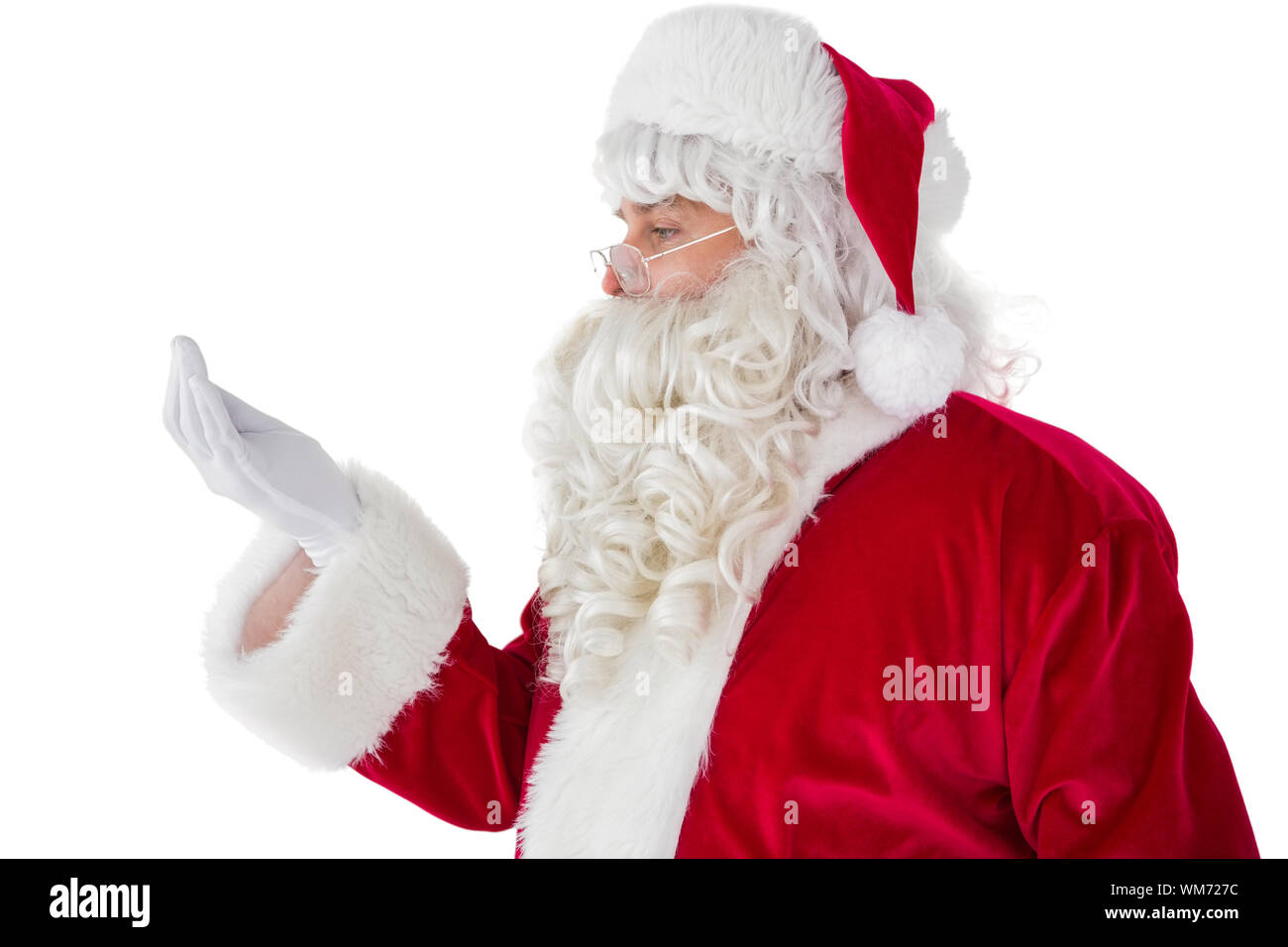 Father christmas with hand out on white background Stock Photo - Alamy