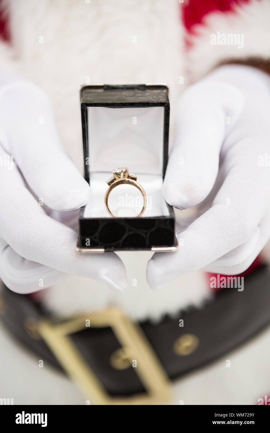 Santa claus holding engagement ring hi-res stock photography and images ...