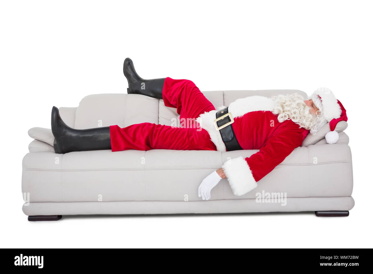Santa claus sleeping on the couch on white background Stock Photo - Alamy
