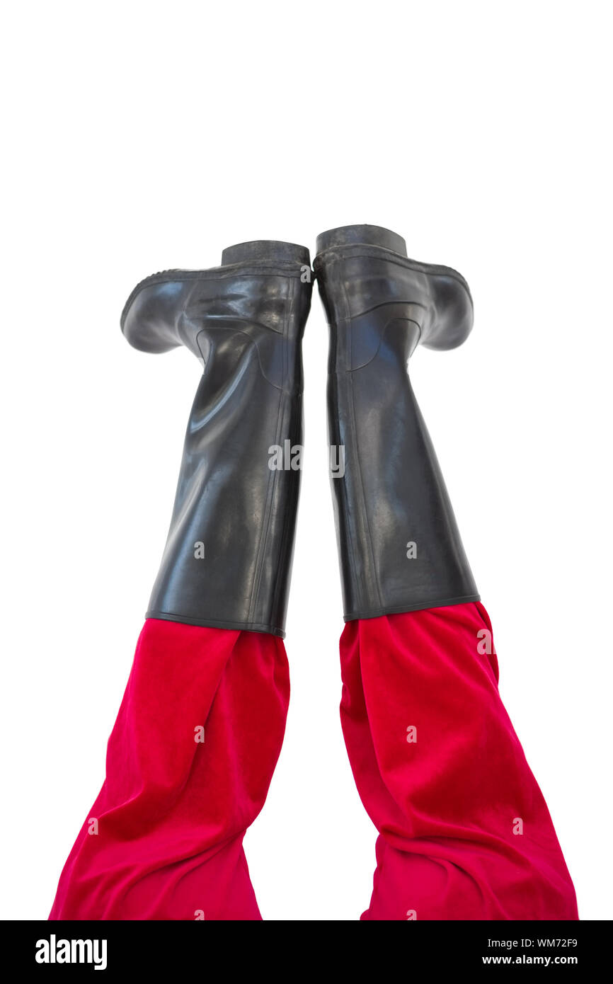 Lower half of santas legs with his black boots on white background ...