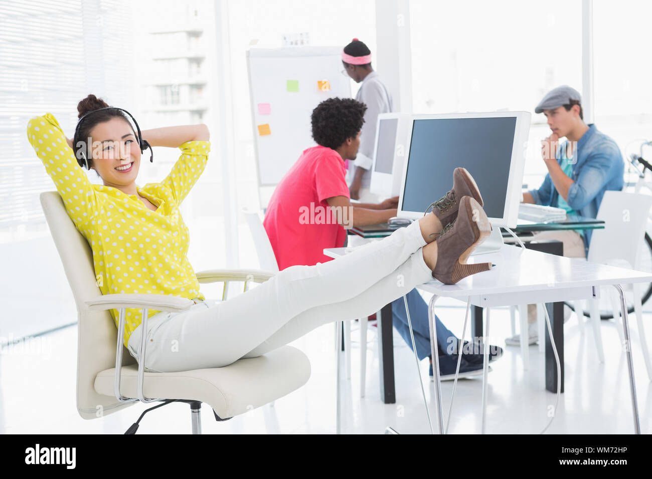Business woman relaxing feet up hi-res stock photography and images - Alamy