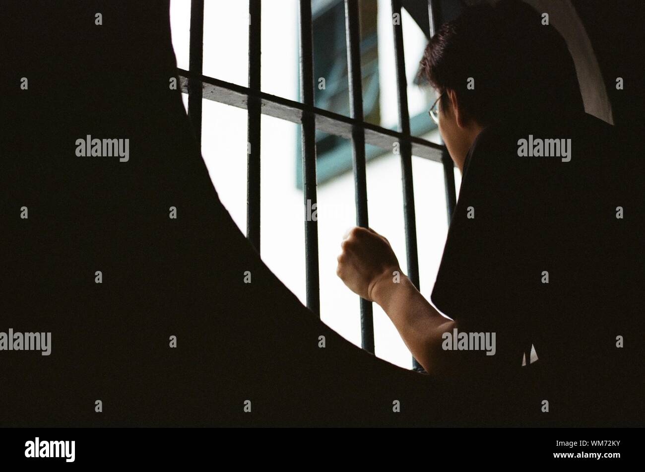 Prisoner Behind Bars High Resolution Stock Photography and Images - Alamy