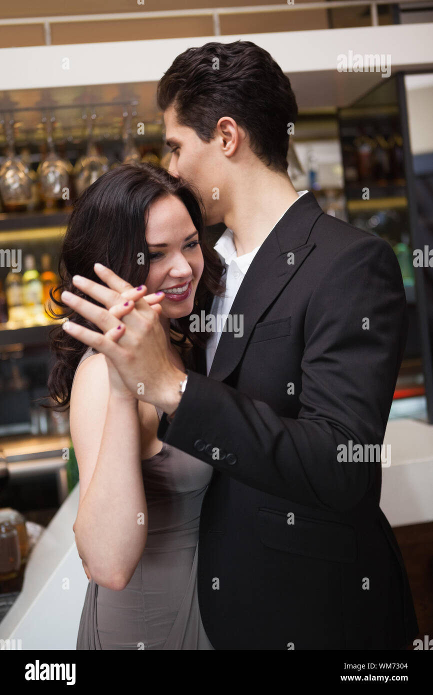 Cute couple slow dancing together at the nightclub Stock Photo - Alamy