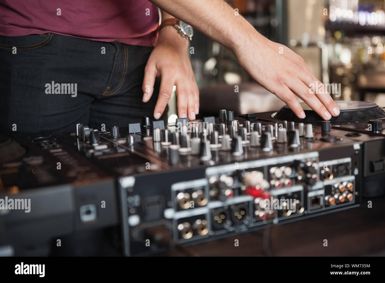 Cool dj spinning the decks at the nightclub Stock Photo - Alamy