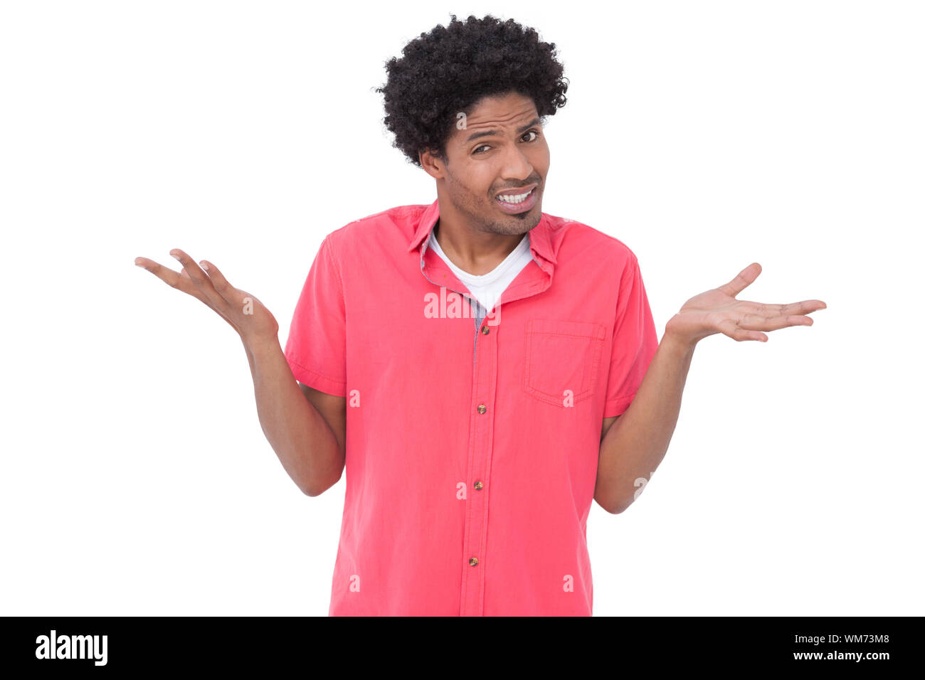 Portrait of a confused man gesturing on white background Stock Photo ...