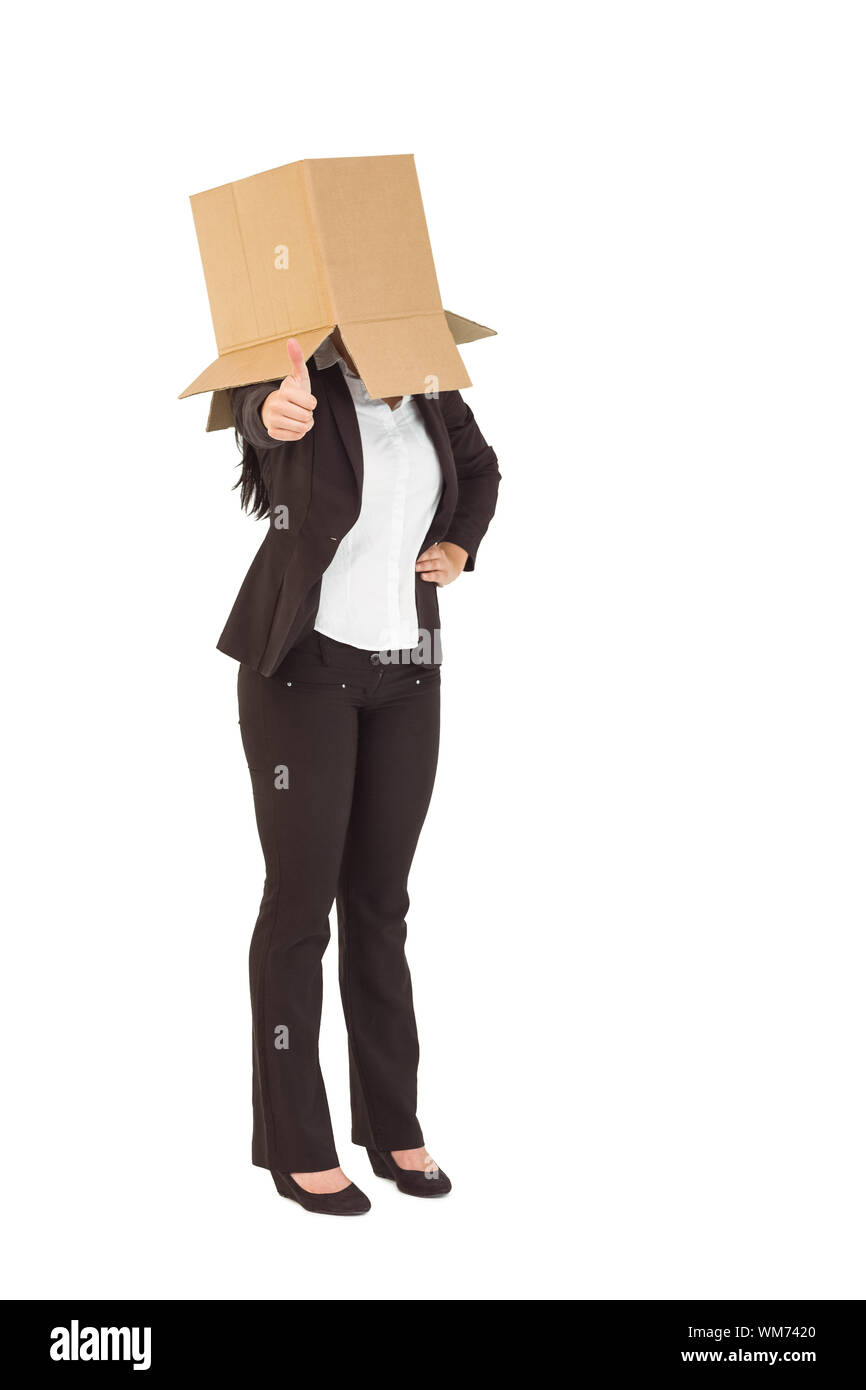 Businesswoman showing thumbs up with box over head on white background ...