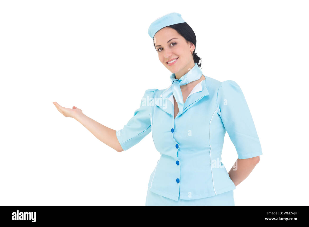 Pretty air hostess presenting with hand on white background Stock Photo ...