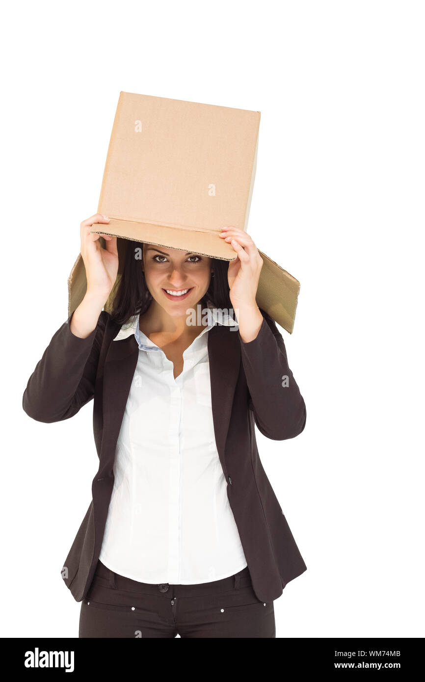 Businesswoman lifting box off head on white background Stock Photo - Alamy