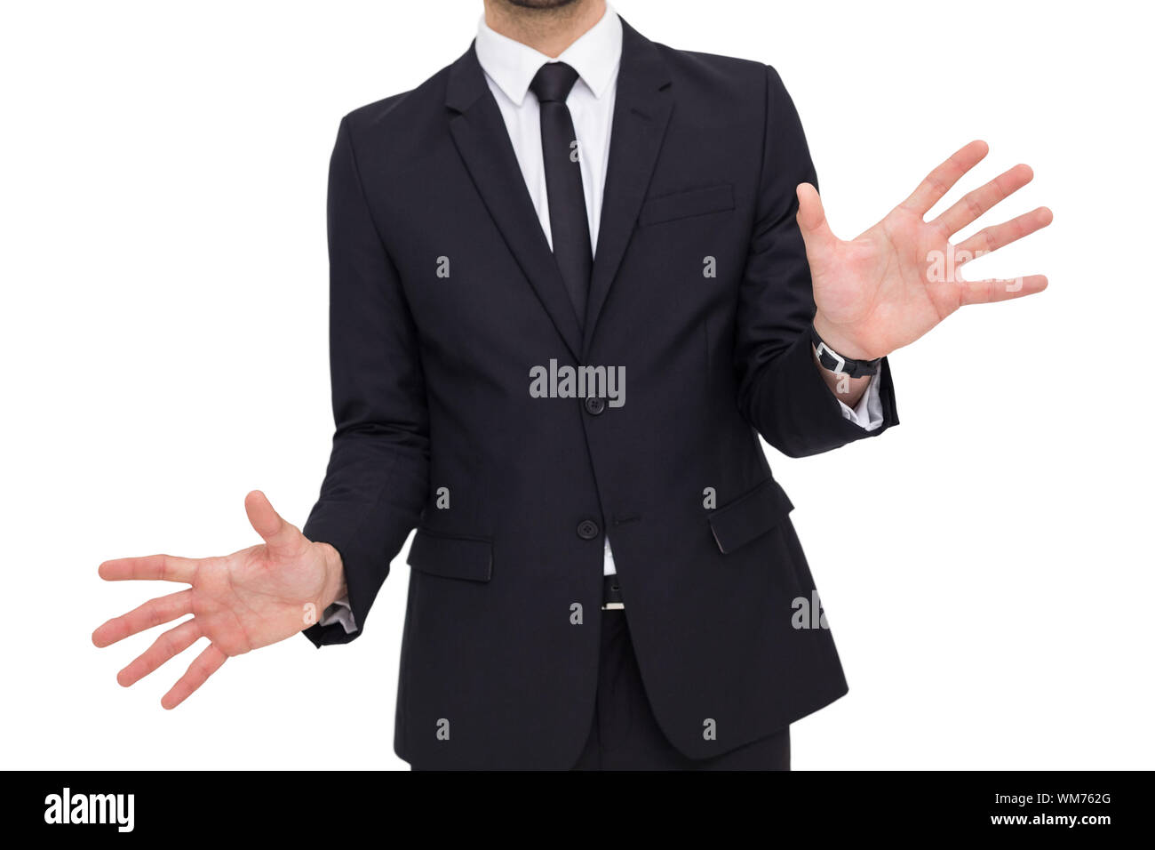 Businessman standing with hands spread out on white background Stock ...