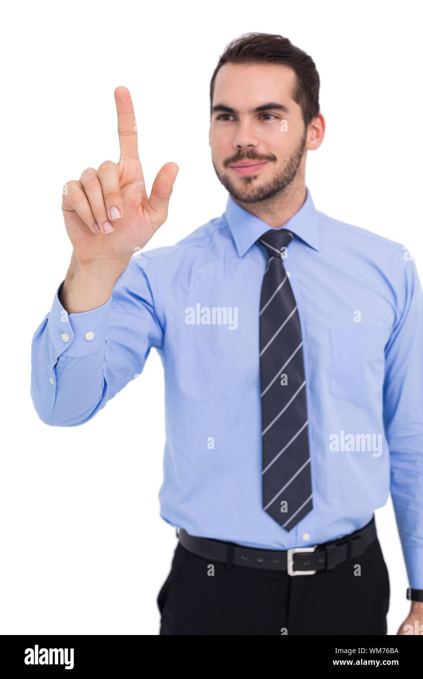 Happy businessman standing and pointing up on white background Stock ...
